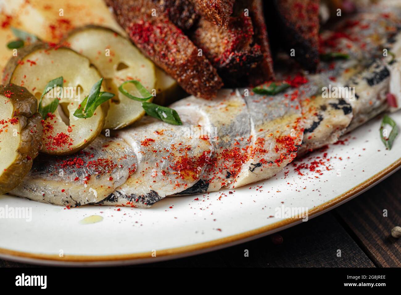 Traditional russian snacks with herring and pickle Stock Photo - Alamy