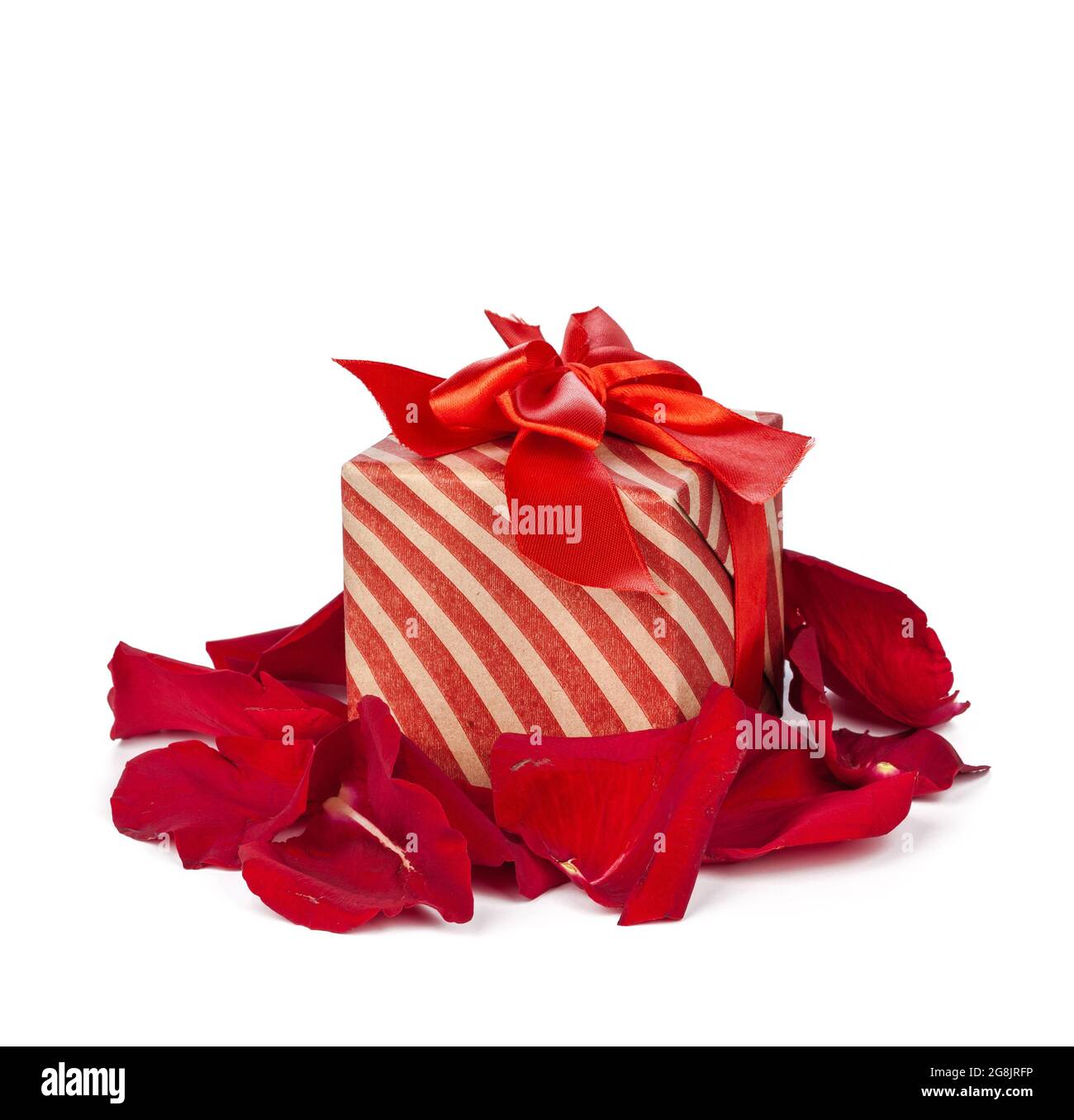 Gift box and rose petal on white background Stock Photo - Alamy