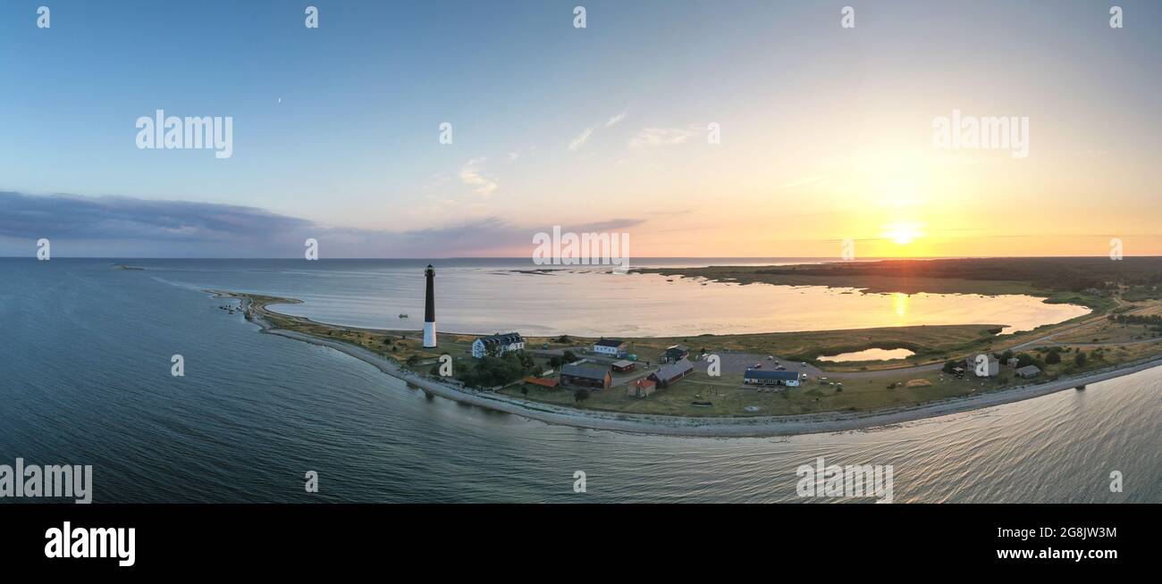 Sunset seascape spit with the lighthouse complex Stock Photo - Alamy