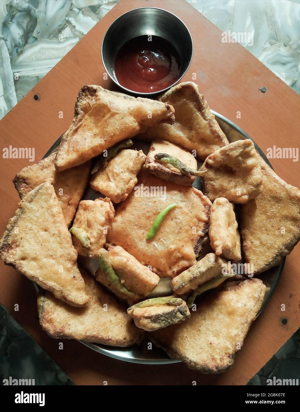 Bread Pakora is an Indian fried snack (pakora or fritter) served with ...