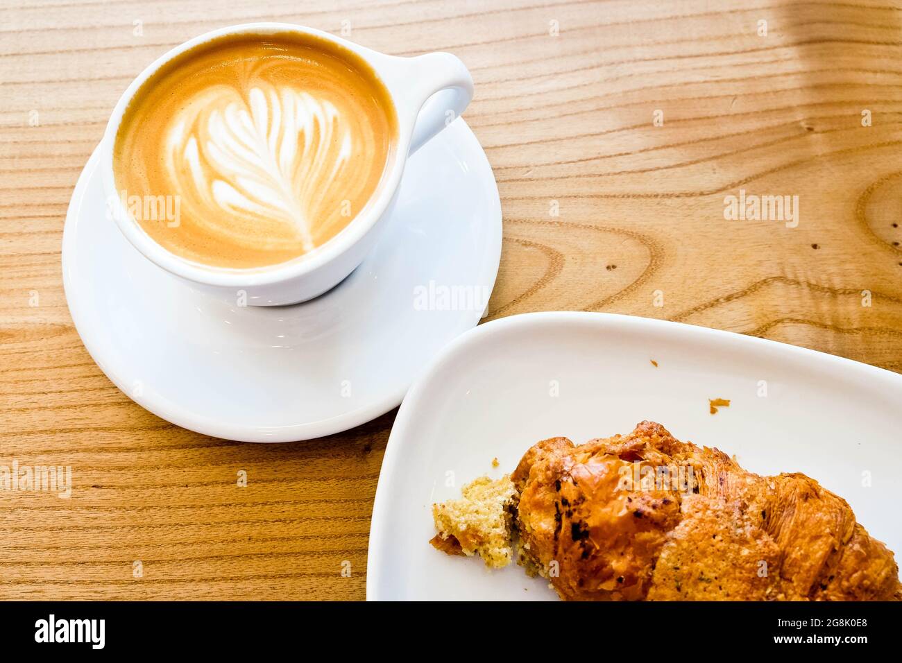 Breakfast set of latte and double baked croissant Stock Photo - Alamy