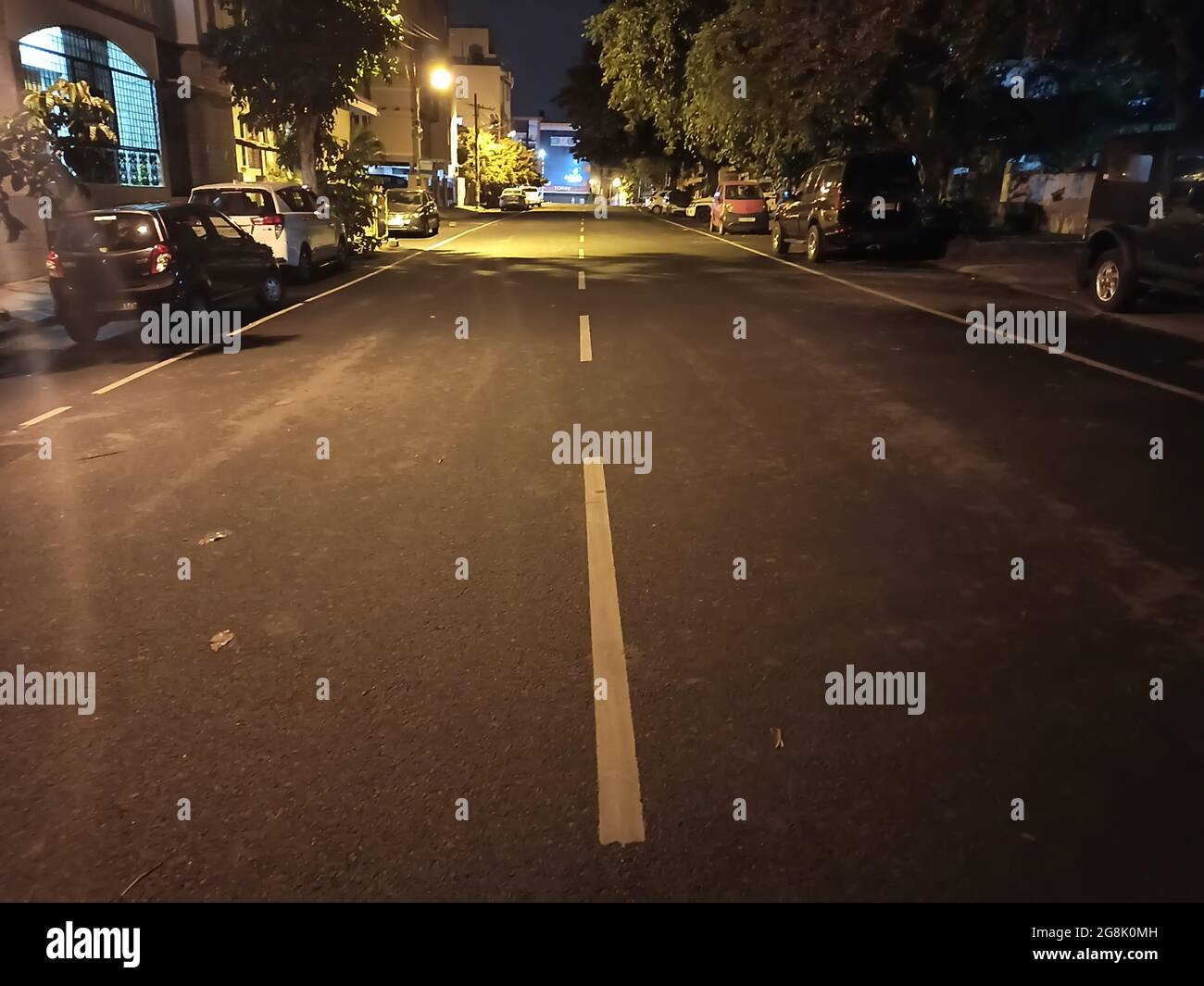 View of an Unmanned Empty City road with dim lighting at Night Stock ...