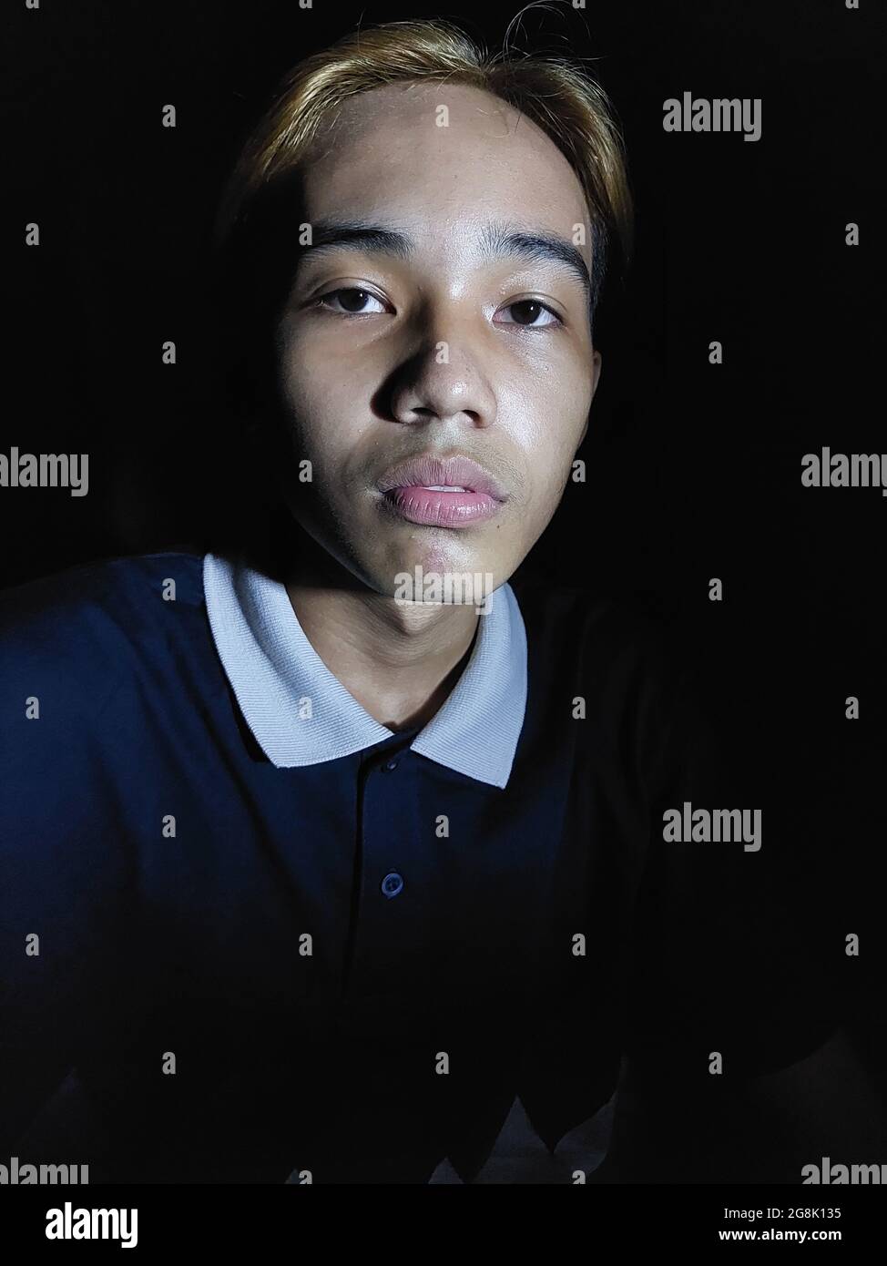 Young man pondering in hi-res stock photography and images - Alamy