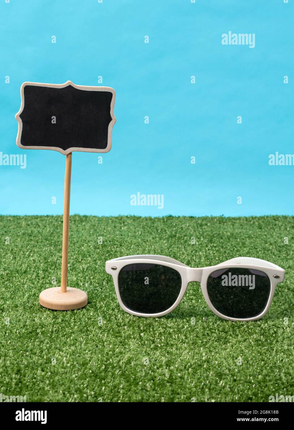 Vertical shot a sunglass and a wooden sign - Tokyo Olympic Games 2021 ...