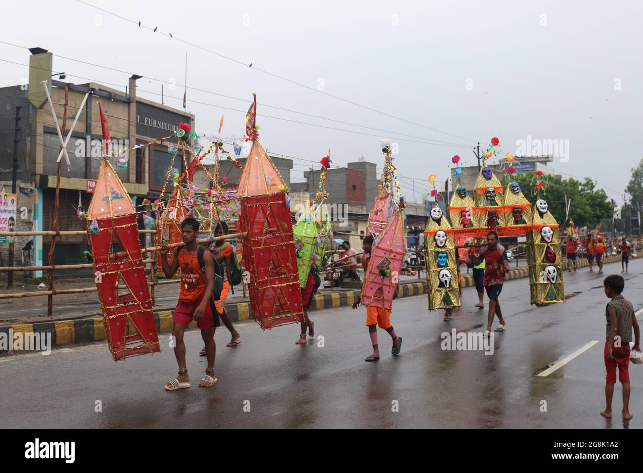 GHAZIABAD, INDIA - JULY 2019: A hindu devotee carrying kanwar on their ...
