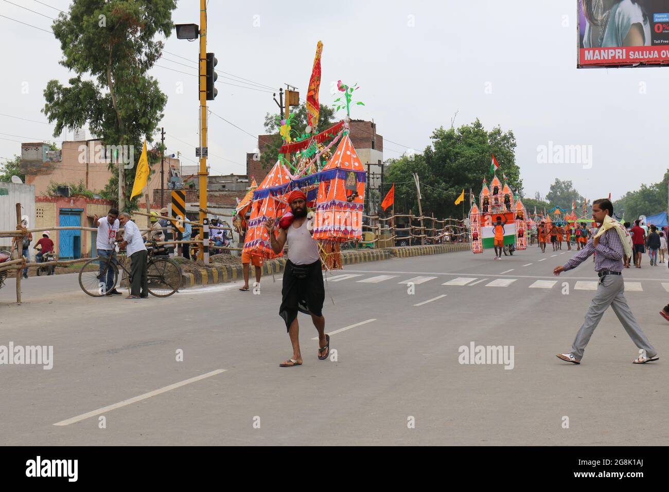 GHAZIABAD, INDIA - JULY 2019: A hindu devotee carrying kanwar on their ...
