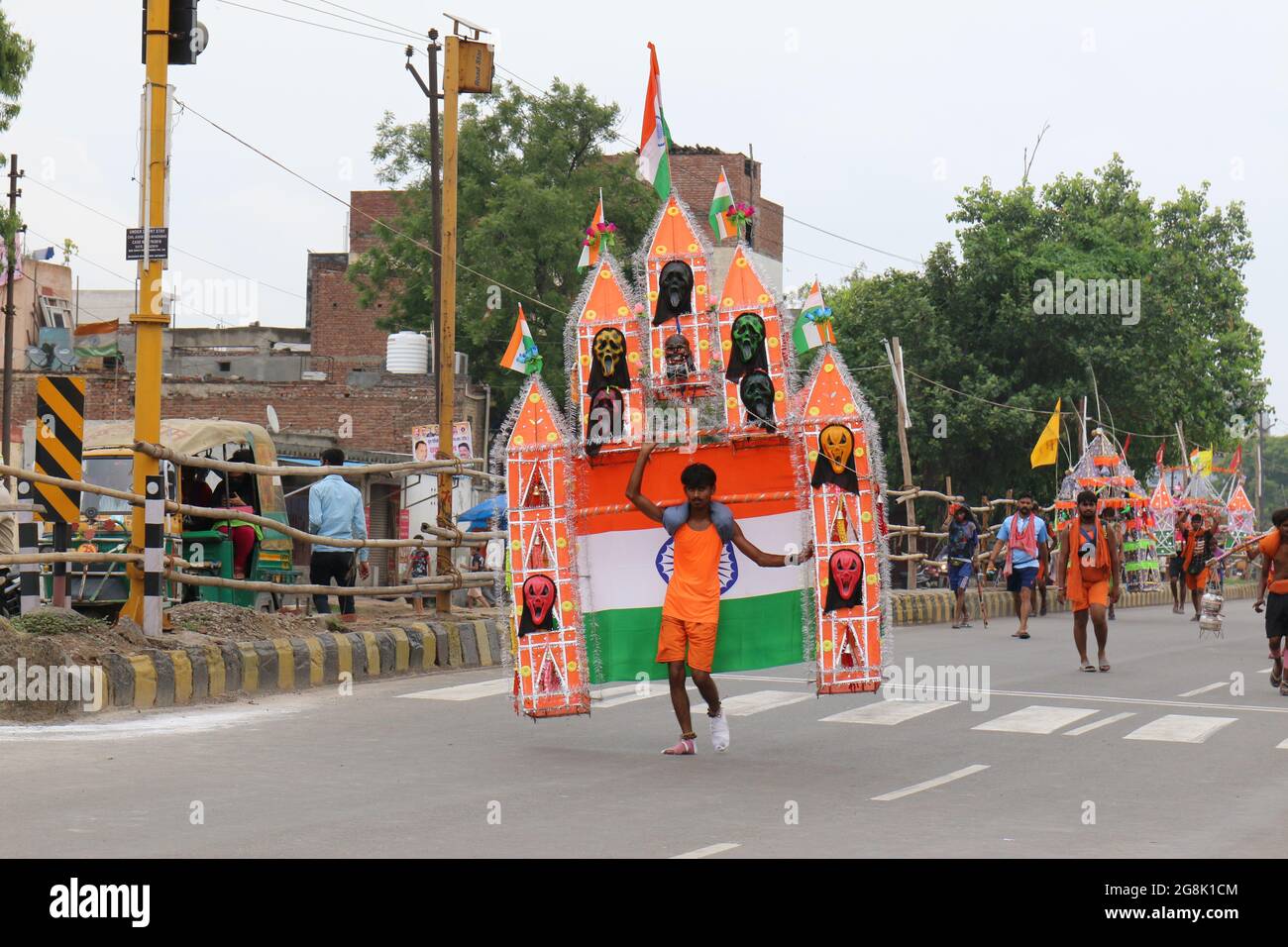 GHAZIABAD, INDIA - JULY 2019: A hindu devotee carrying kanwar on their ...