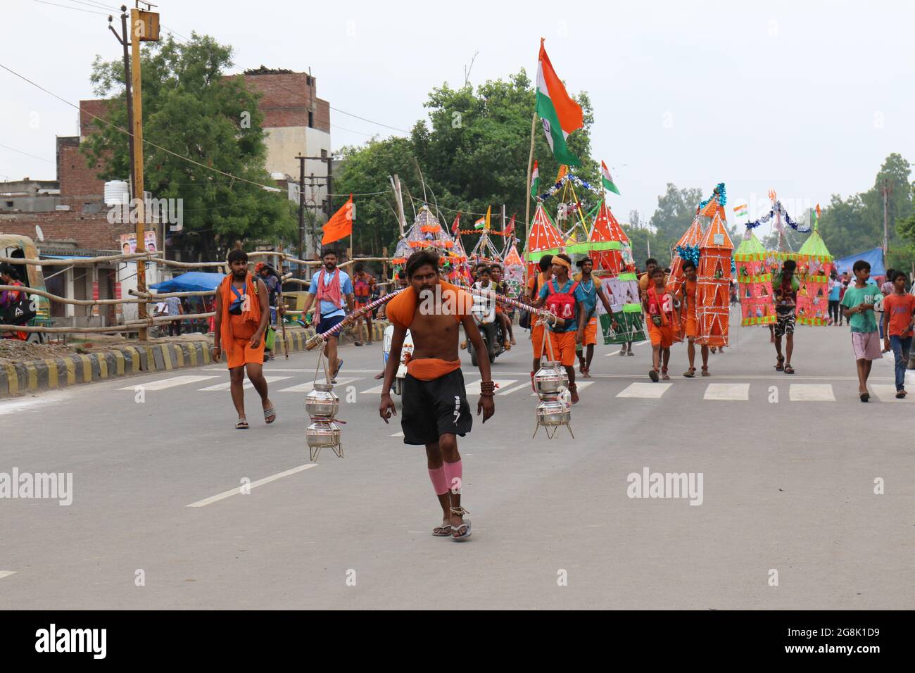 GHAZIABAD, INDIA - JULY 2019: A hindu devotee carrying kanwar on their ...