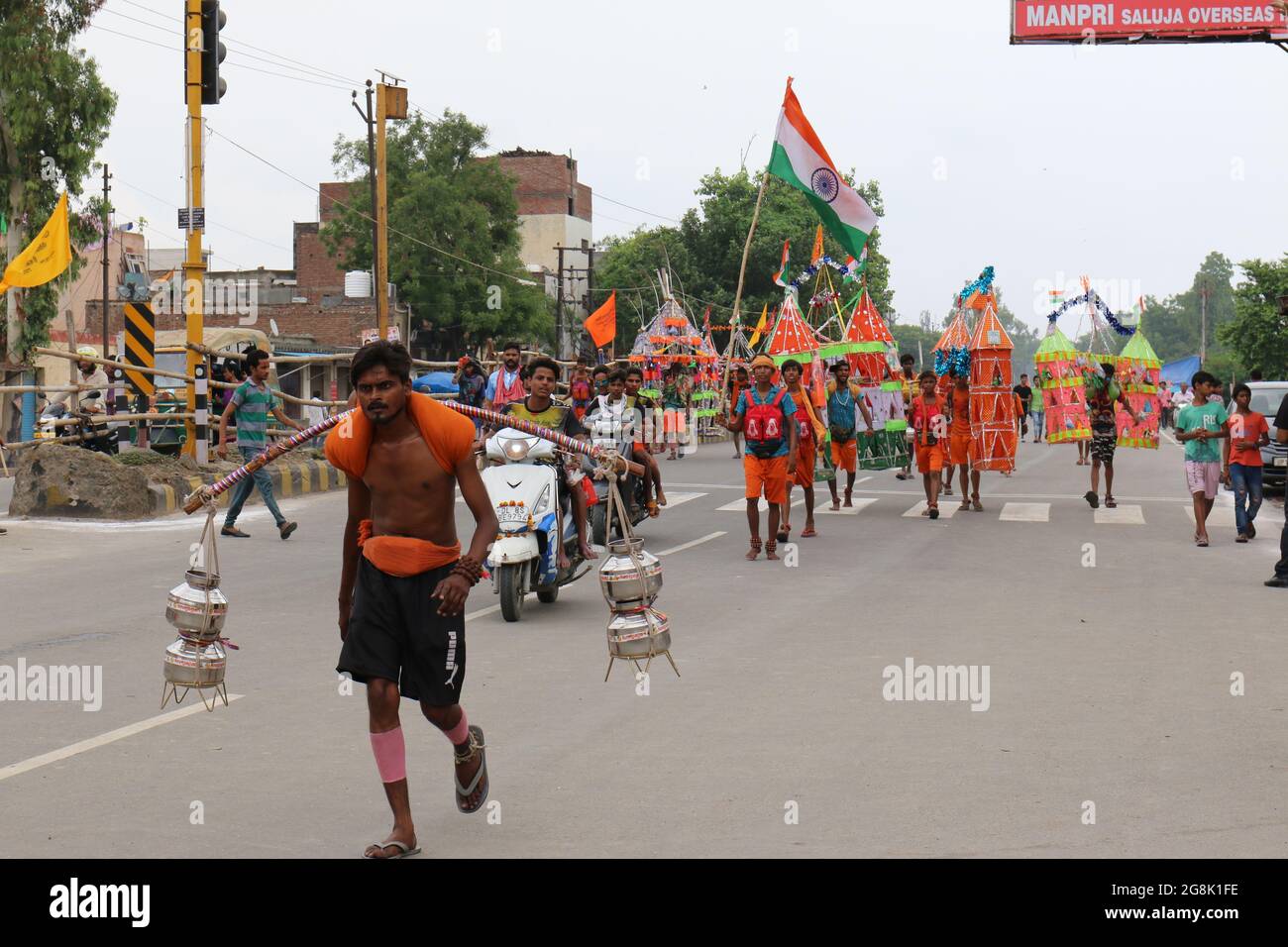 GHAZIABAD, INDIA - JULY 2019: A hindu devotee carrying kanwar on their ...