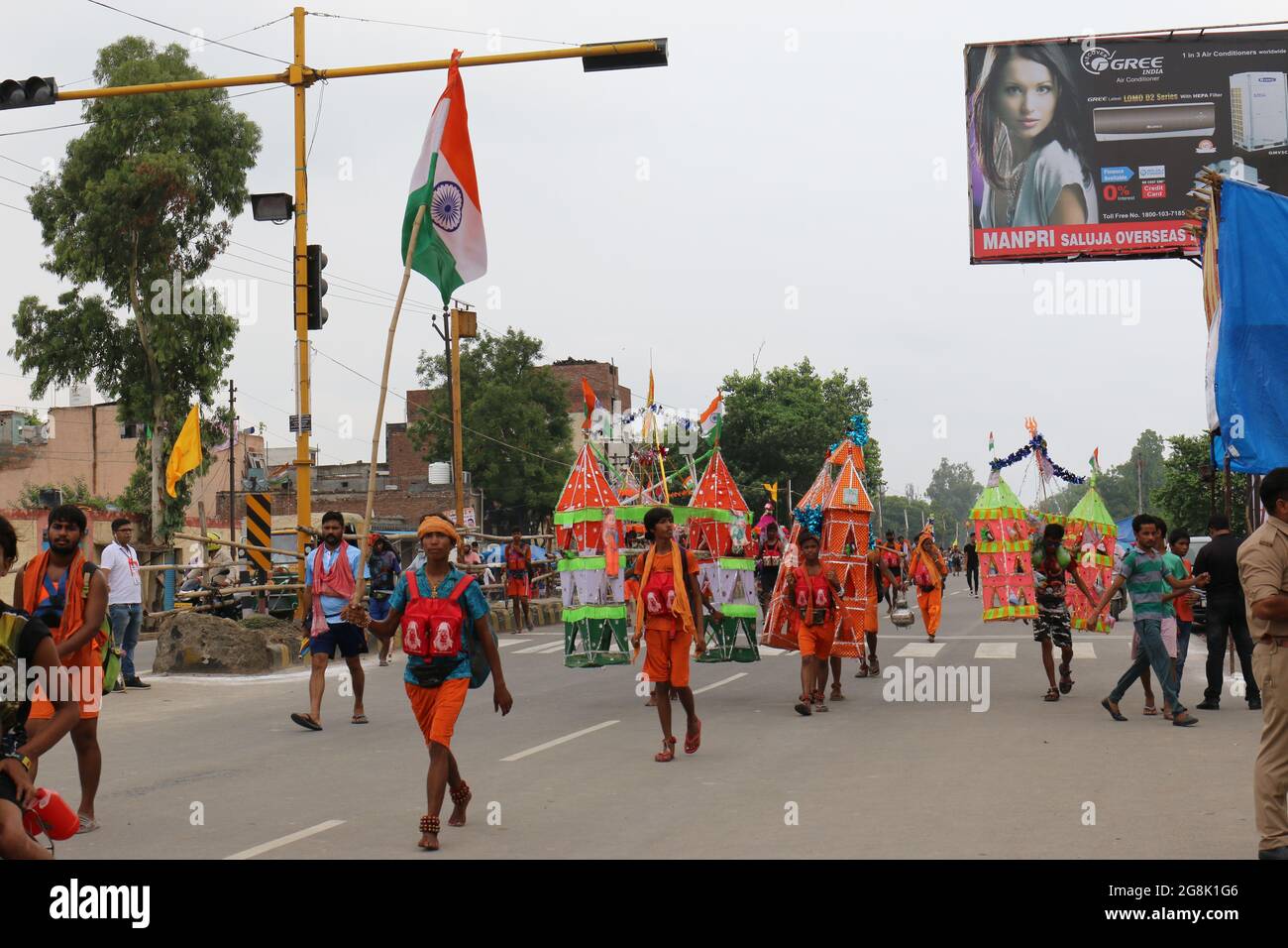 GHAZIABAD, INDIA - JULY 2019: A hindu devotee carrying kanwar on their ...