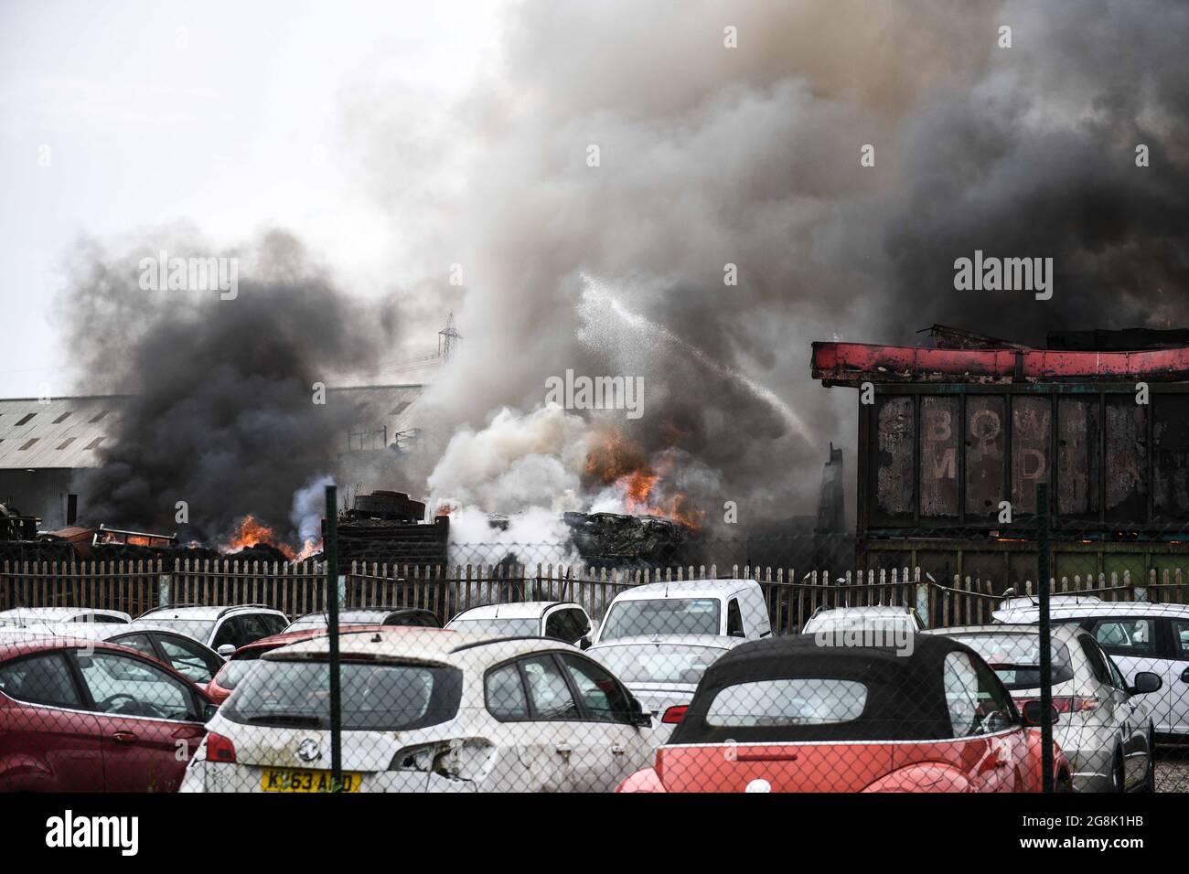 The fire service battle to control a large fire at an industrial estate ...