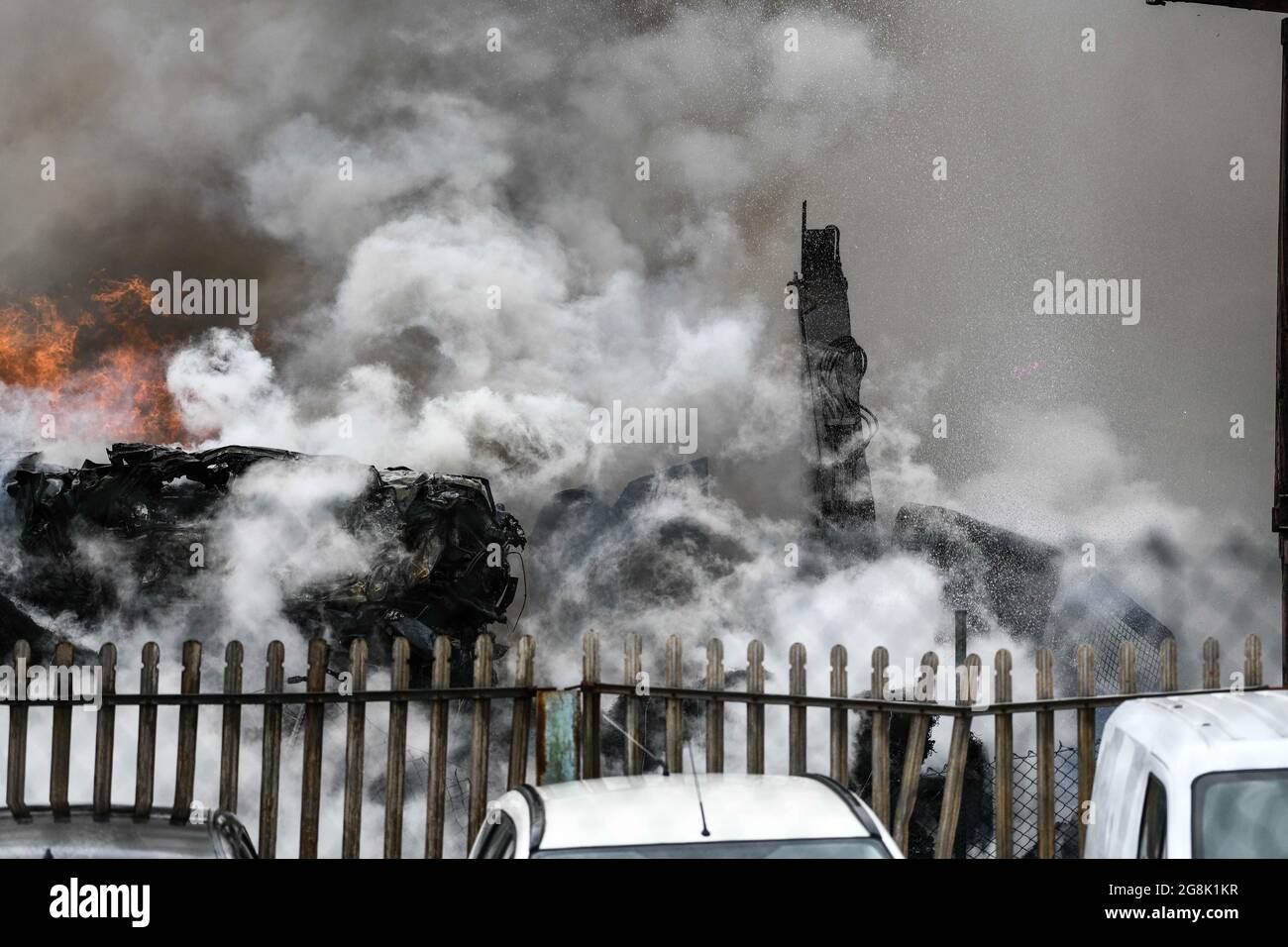 The fire service battle to control a large fire at an industrial estate ...