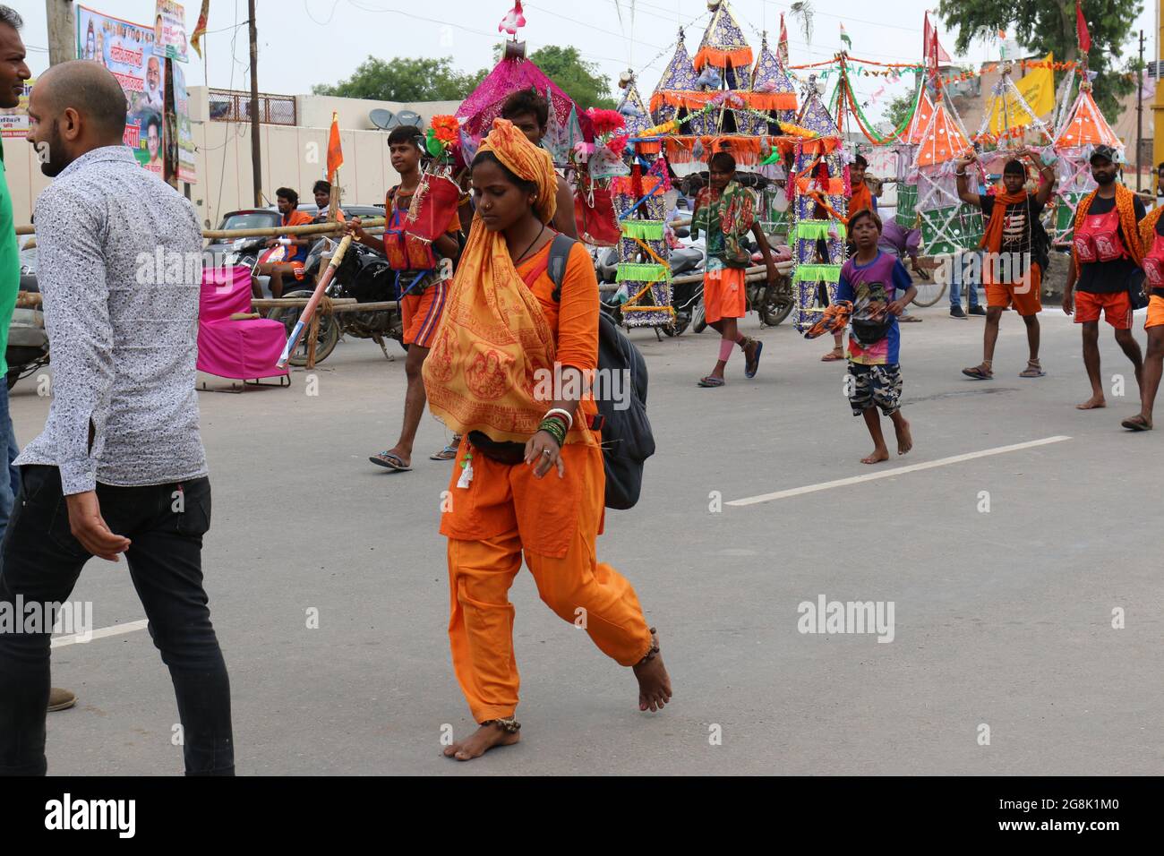GHAZIABAD, INDIA - JULY 2019: A hindu devotee carrying kanwar on their ...