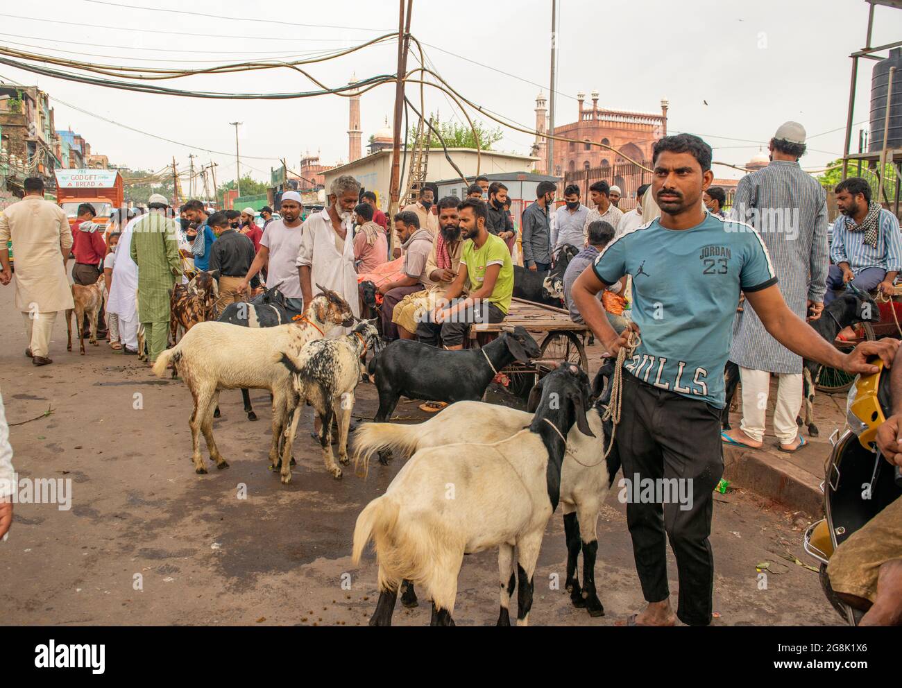 A man sells goats near Jama Masjid during the Eid al-Adha festival, the ...