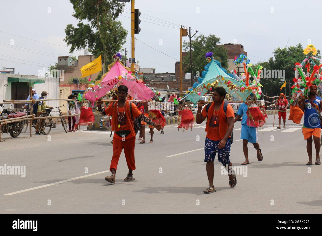 GHAZIABAD, INDIA - JULY 2019: A hindu devotee carrying kanwar on their ...