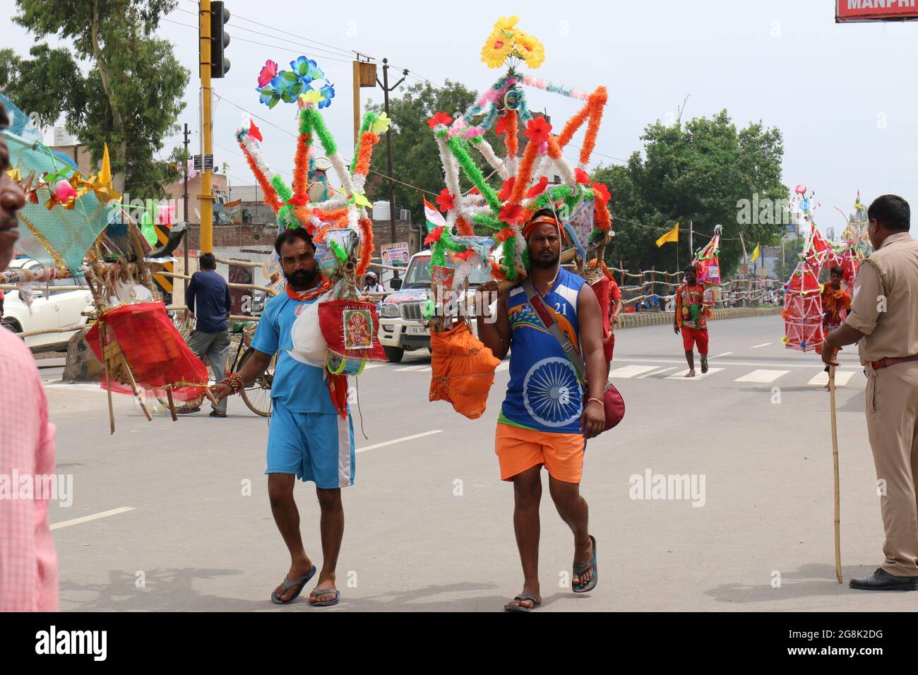 GHAZIABAD, INDIA - JULY 2019: A hindu devotee carrying kanwar on their ...