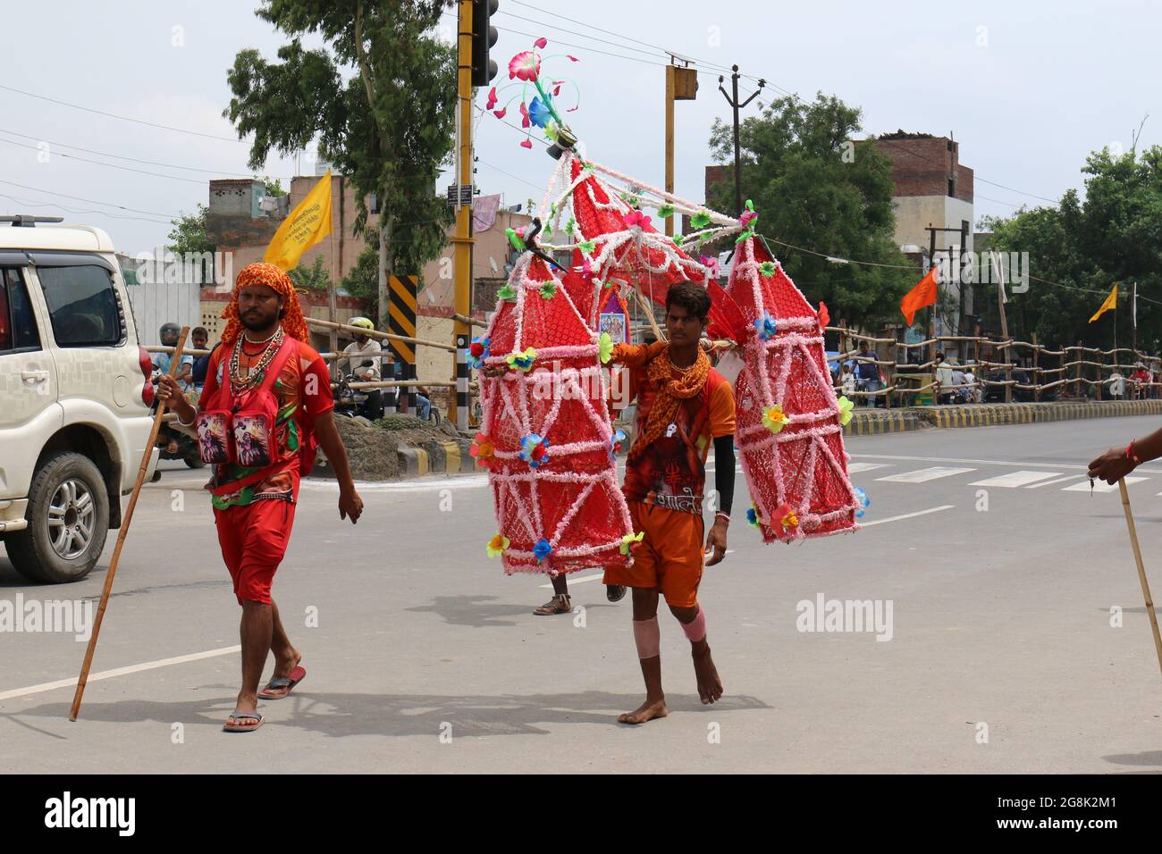 GHAZIABAD, INDIA - JULY 2019: A hindu devotee carrying kanwar on their ...