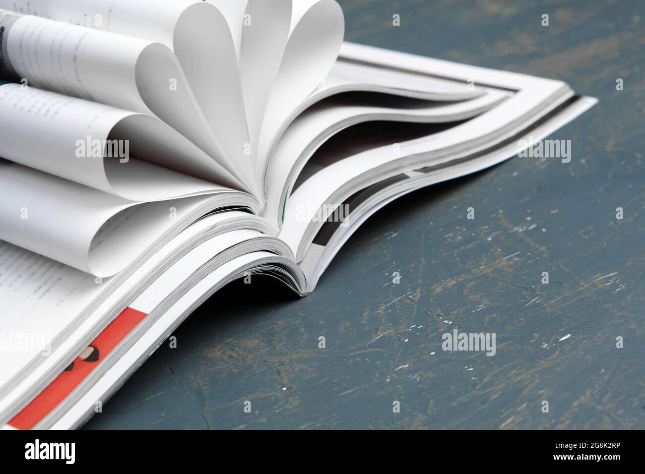 Close up stacking magazine place on table background Stock Photo - Alamy