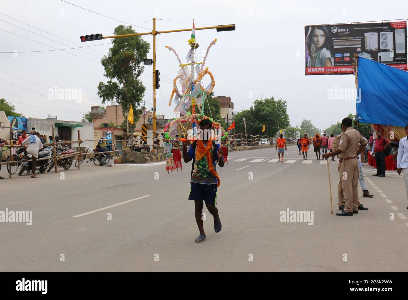 GHAZIABAD, INDIA - JULY 2019: A hindu devotee carrying kanwar on their ...
