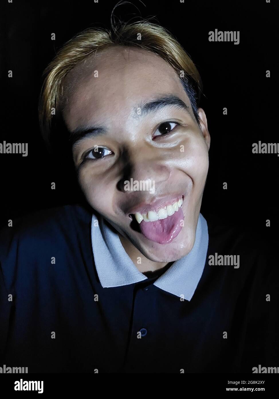 Male Making Funny Faces Isolated On Black Stock Photo - Alamy