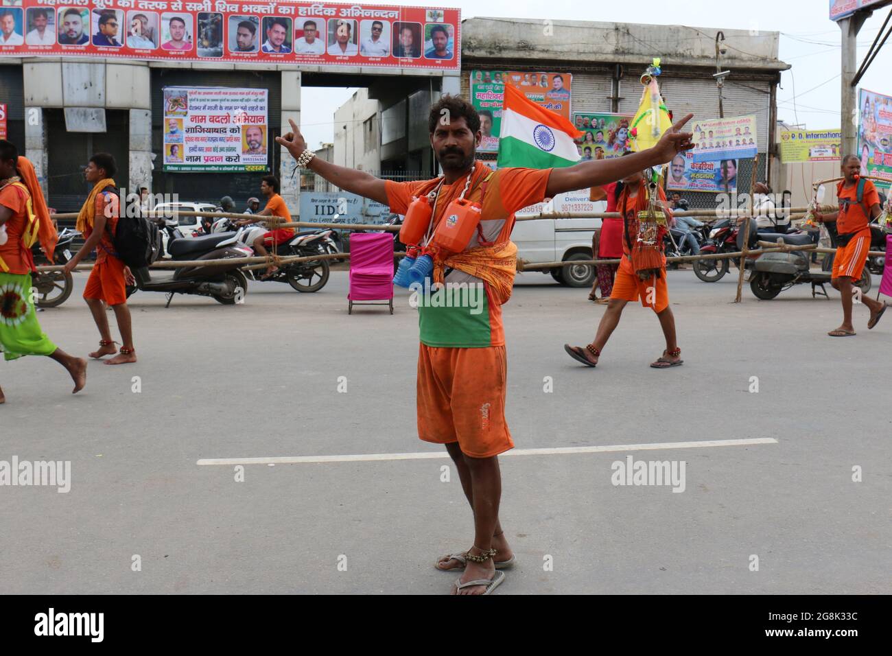 GHAZIABAD, INDIA - JULY 2019: A hindu devotee carrying kanwar on their ...