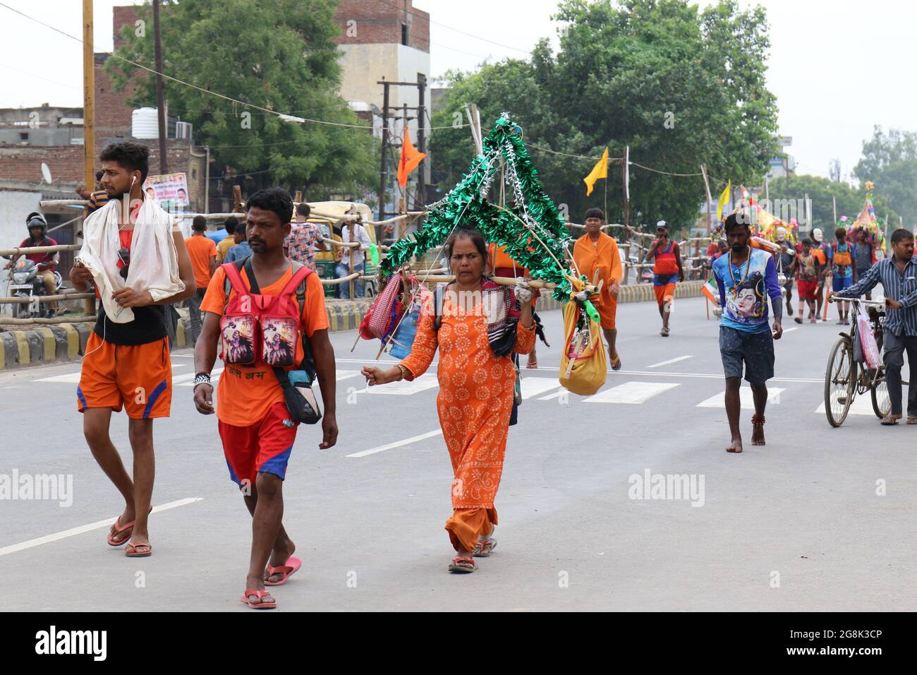 GHAZIABAD, INDIA - JULY 2019: A hindu devotee carrying kanwar on their ...