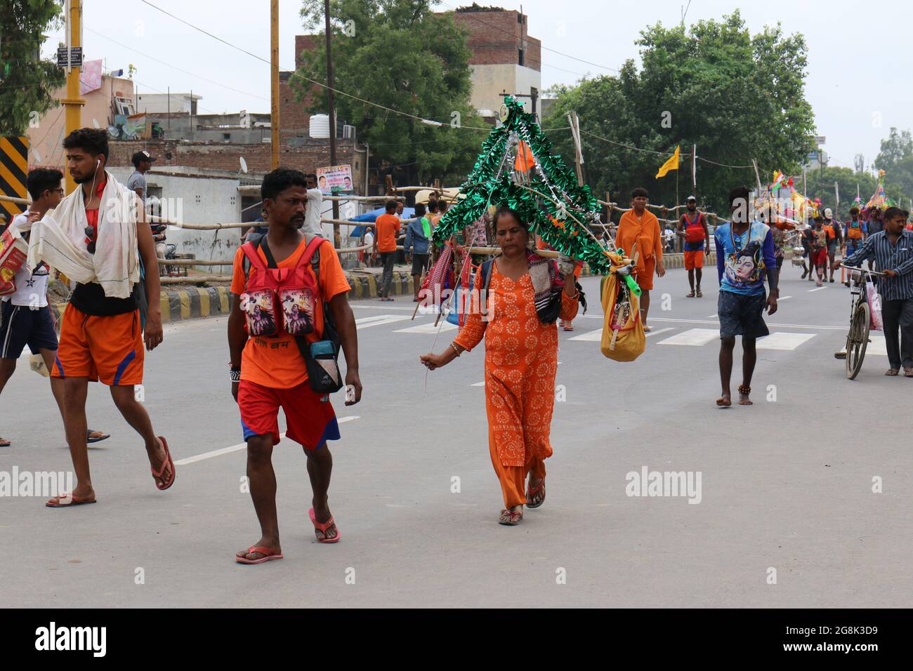 GHAZIABAD, INDIA - JULY 2019: A hindu devotee carrying kanwar on their ...