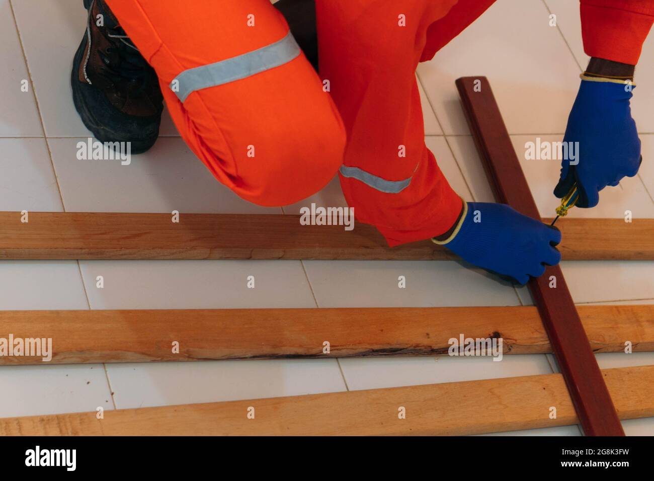 African American man taking measurements inside a house Stock Photo - Alamy
