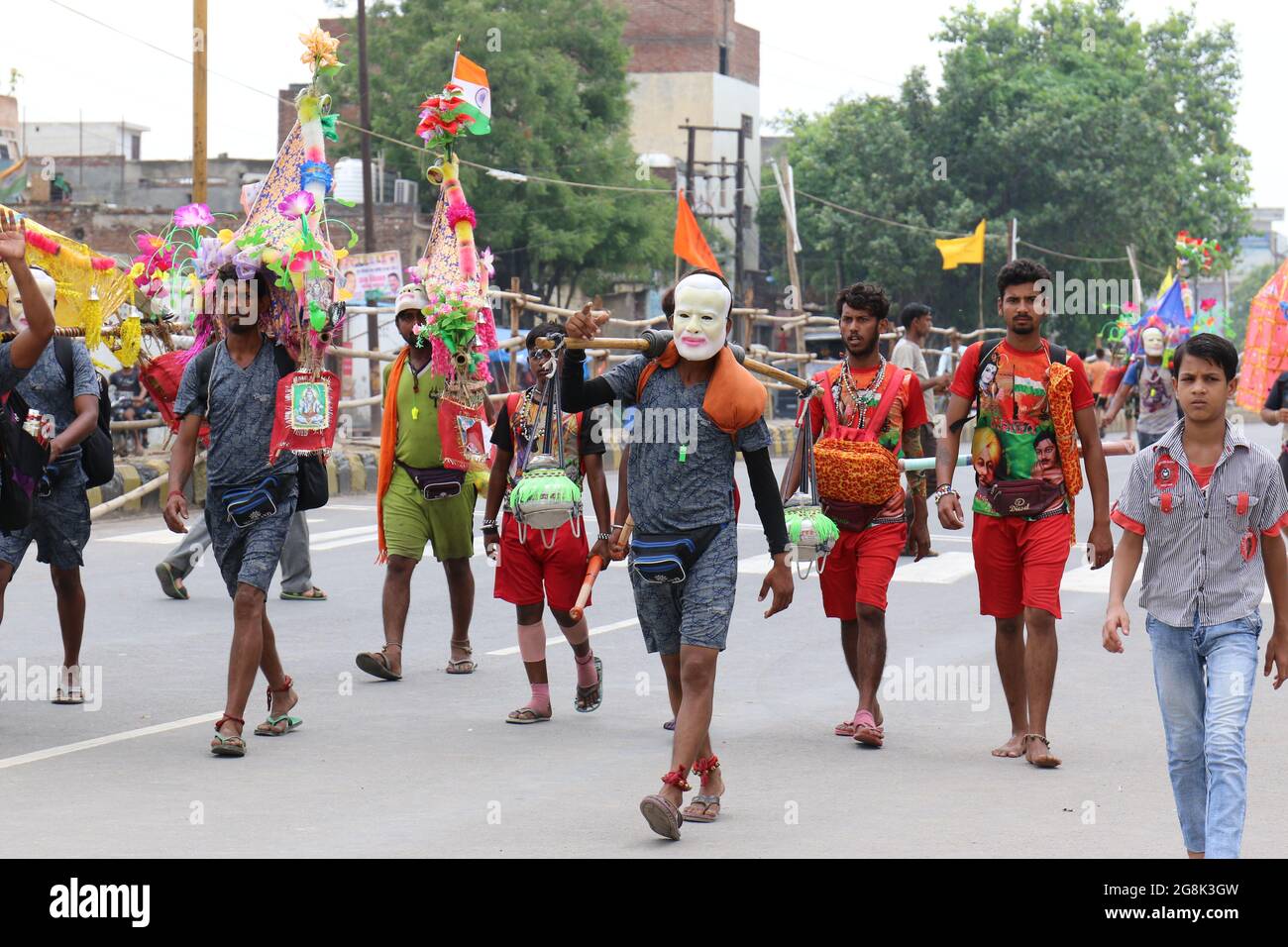 GHAZIABAD, INDIA - JULY 2019: A hindu devotee carrying kanwar on their ...