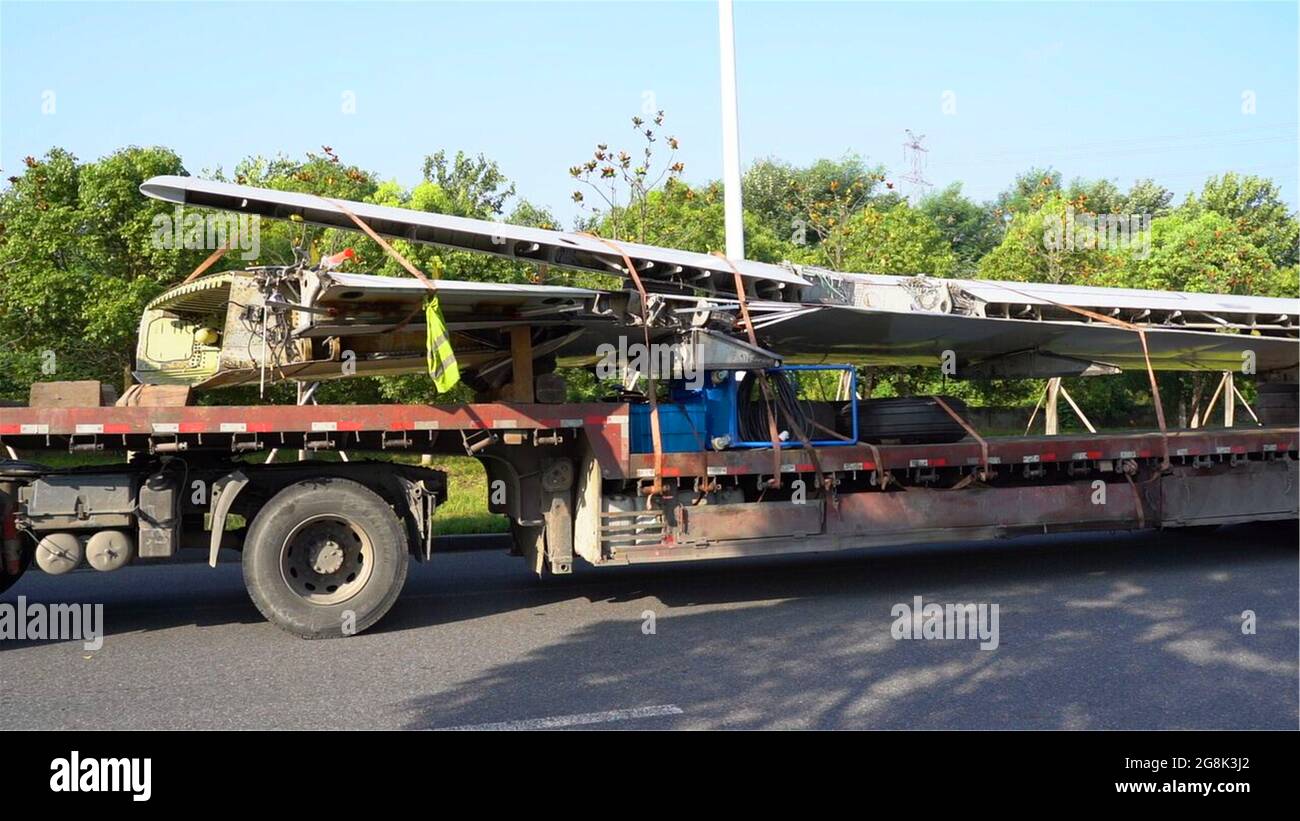A row of trucks hauling an Airbus A320 aircraft on the Danjie Highway ...