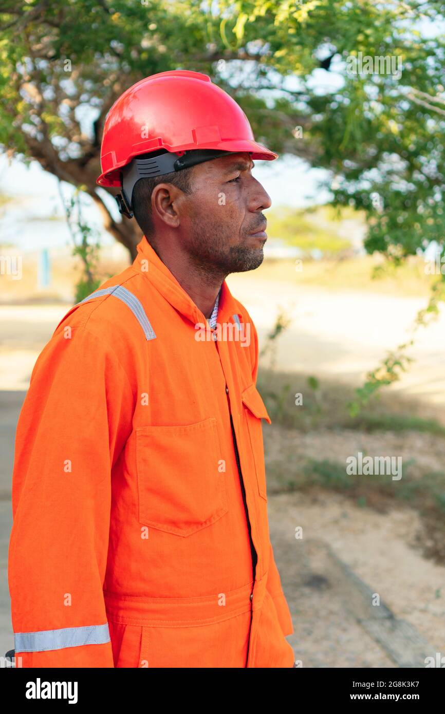 Concept of engineer or technician. African male mechanic in orange ...