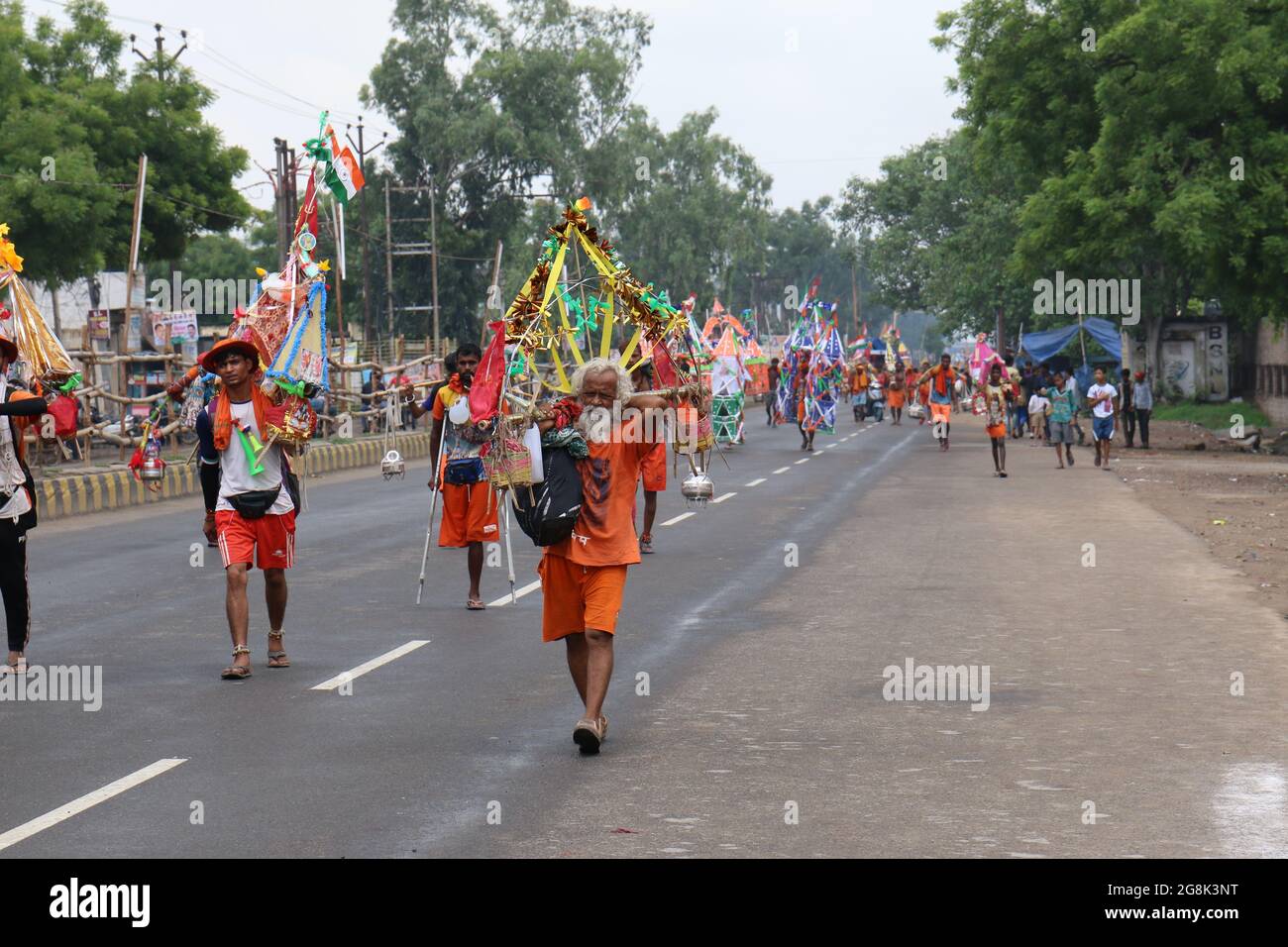 GHAZIABAD, INDIA - JULY 2019: A hindu devotee carrying kanwar on their ...
