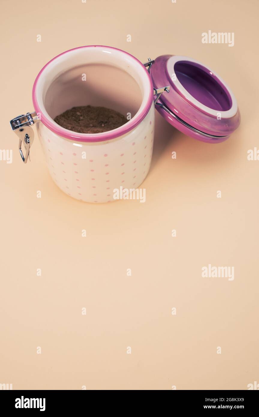 Plastic container for tea isolated on a beige background Stock Photo ...