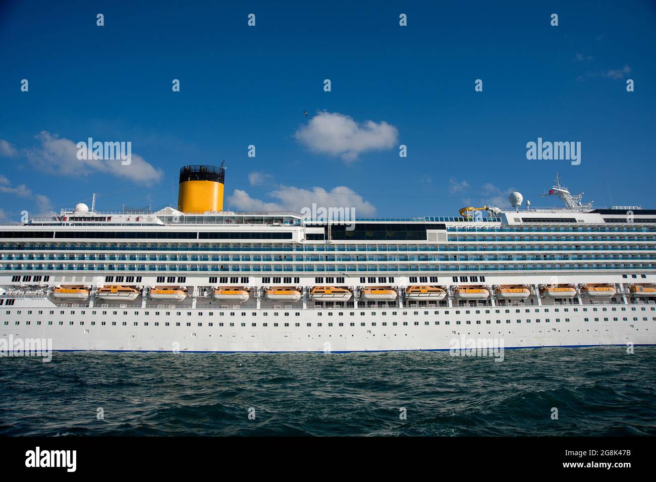 Blue sky with big cruise ship from side view Stock Photo - Alamy