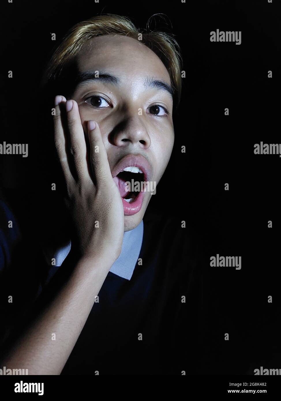 Surprised Minority Male Man Isolated On Black Stock Photo - Alamy