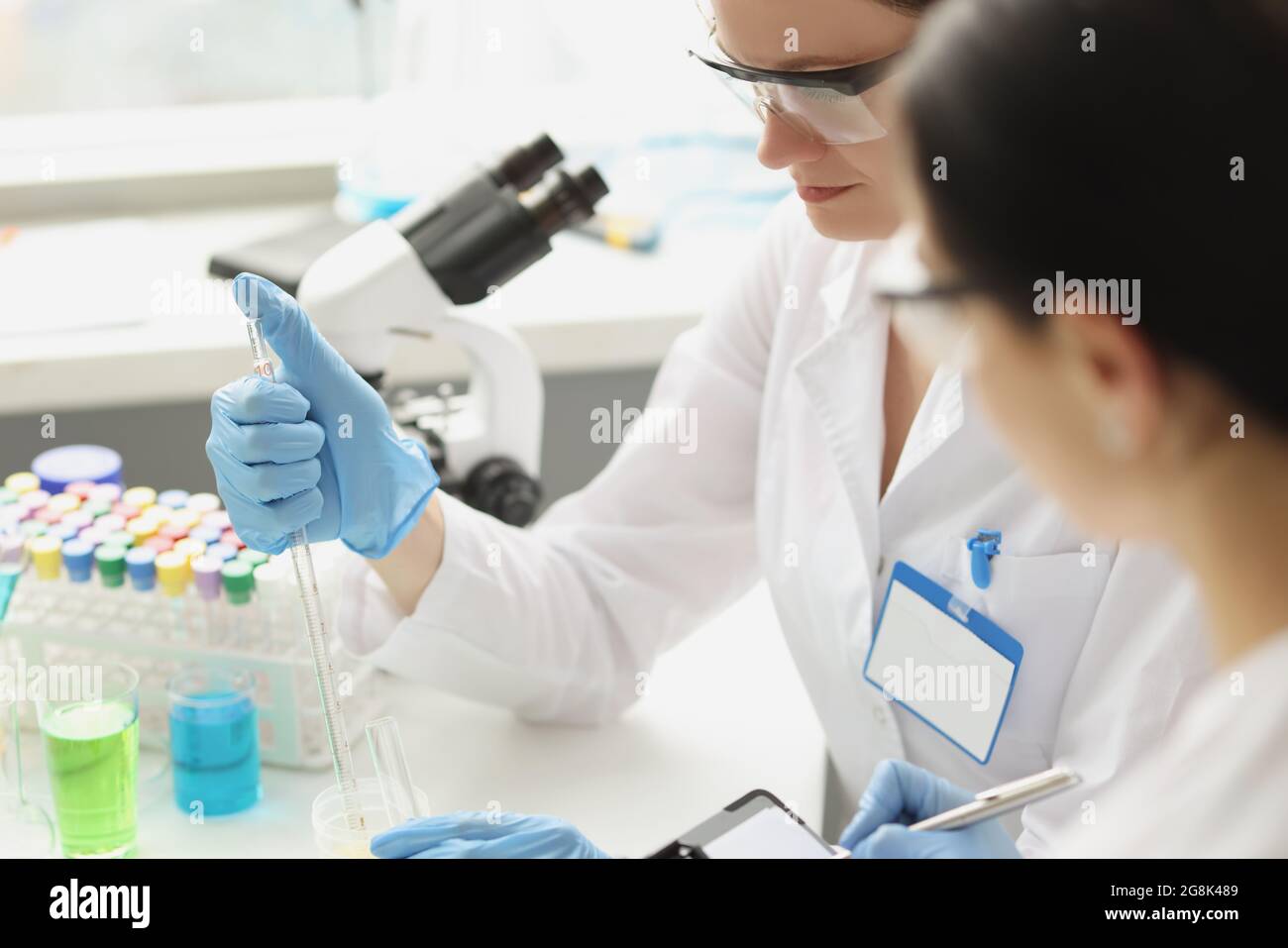 Two scientists conducting research in chemical laboratory Stock Photo ...