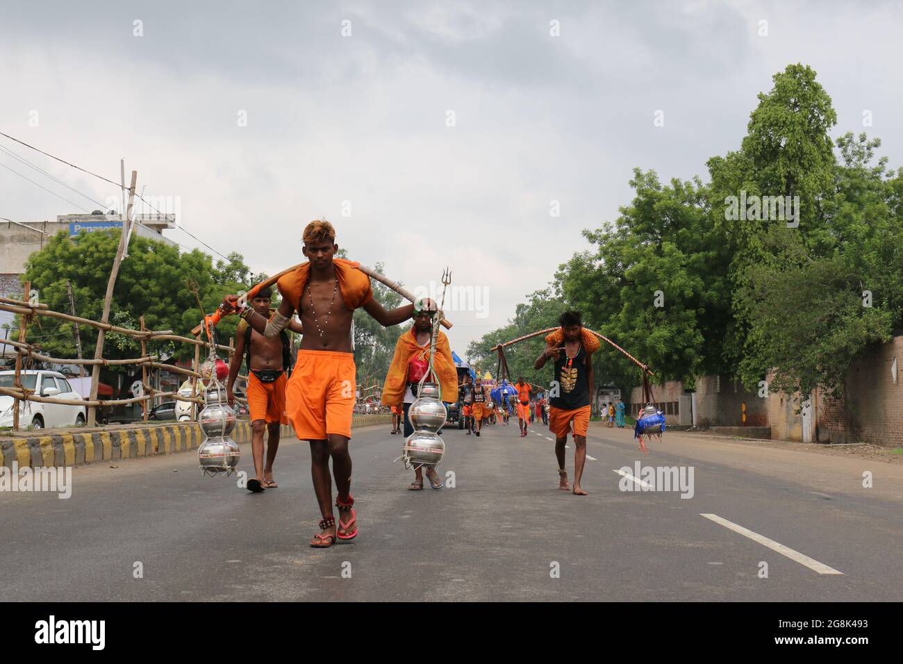 GHAZIABAD, INDIA - JULY 2019: A hindu devotee carrying kanwar on their ...