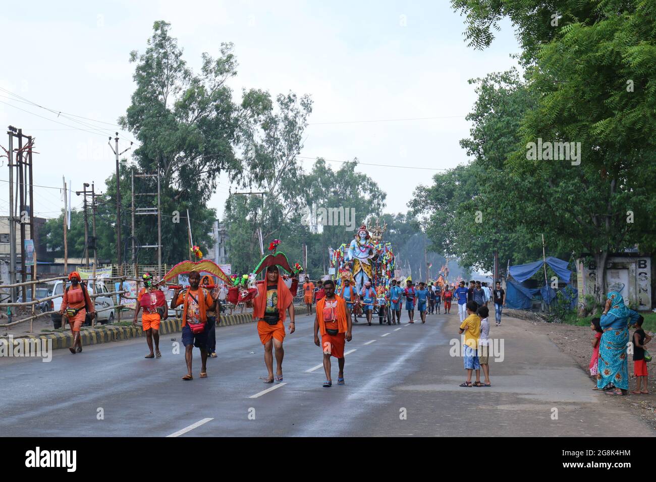 GHAZIABAD, INDIA - JULY 2019: A hindu devotee carrying kanwar on their ...