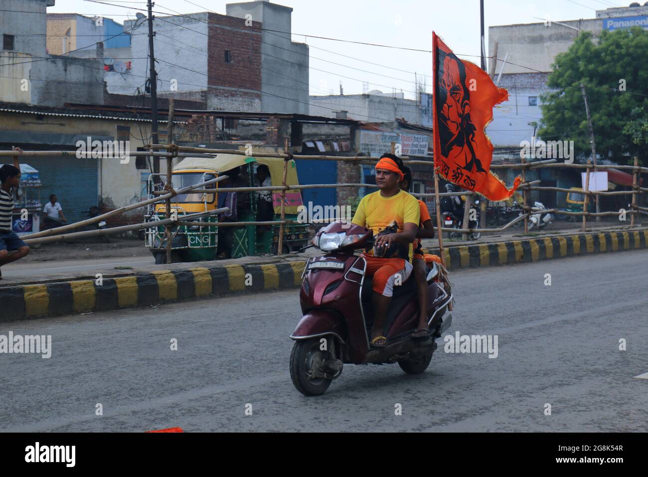 GHAZIABAD, INDIA - JULY 2019: A hindu devotee carrying kanwar on their ...
