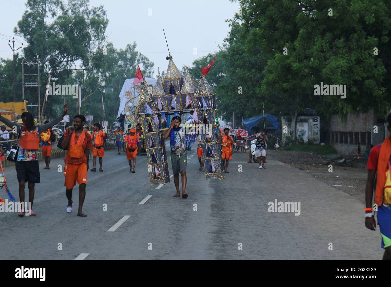 GHAZIABAD, INDIA - JULY 2019: A hindu devotee carrying kanwar on their ...