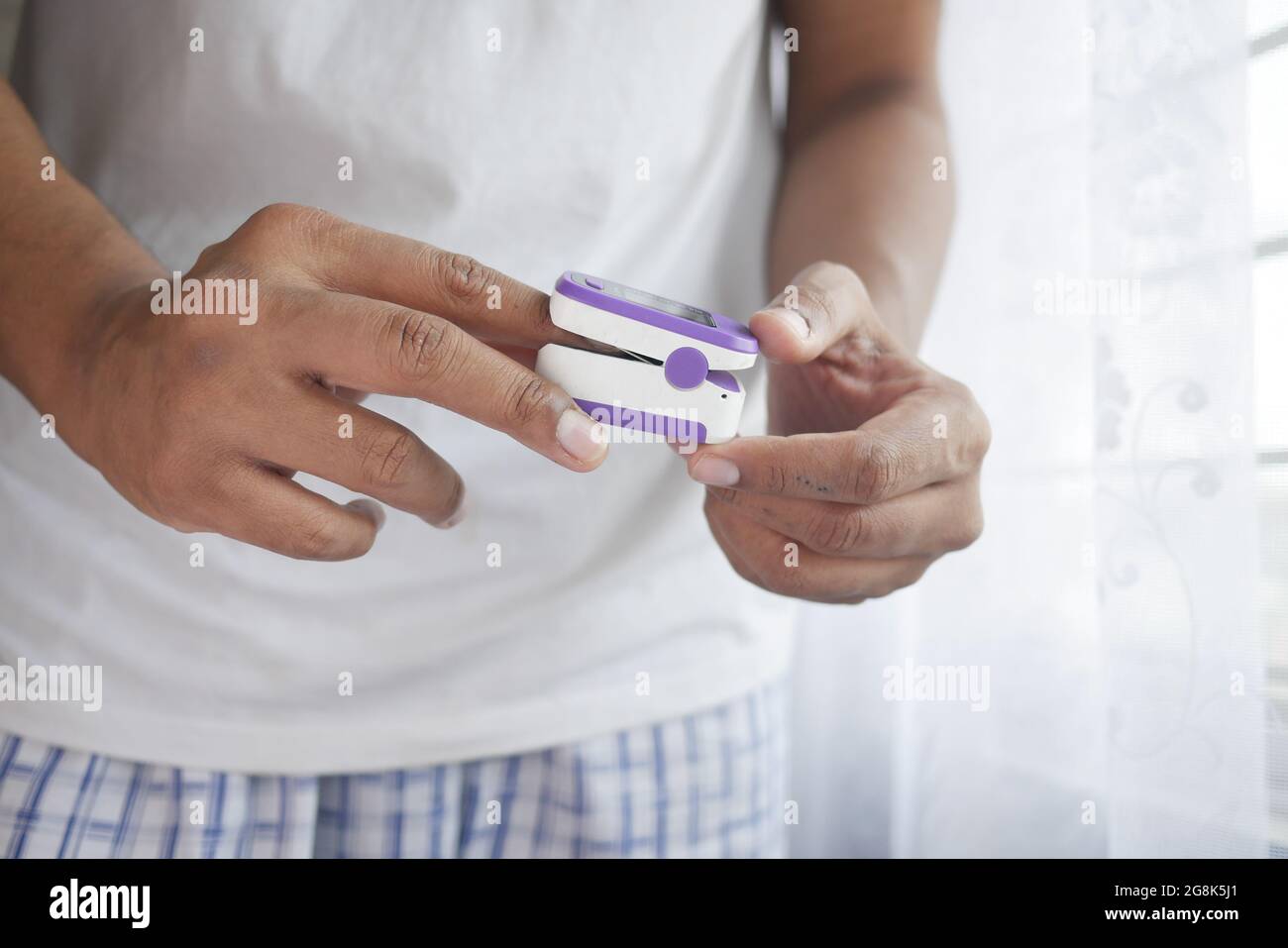 Elderly women hand using pulse hi-res stock photography and images - Alamy