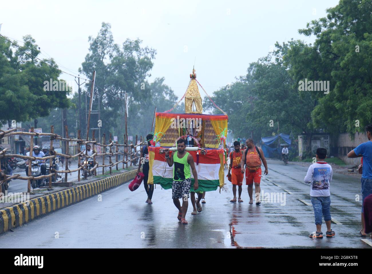 GHAZIABAD, INDIA - JULY 2019: A hindu devotee carrying kanwar on their ...