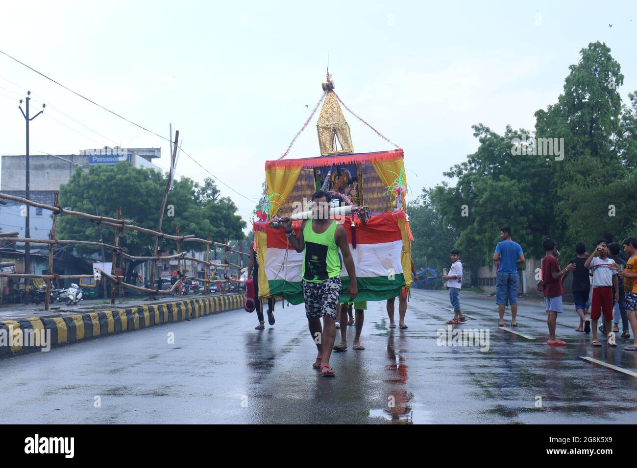 GHAZIABAD, INDIA - JULY 2019: A hindu devotee carrying kanwar on their ...