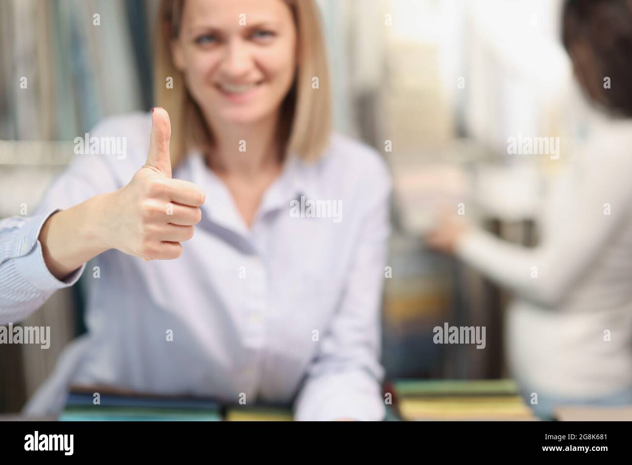 Salesman showing thumbs up hi-res stock photography and images - Alamy