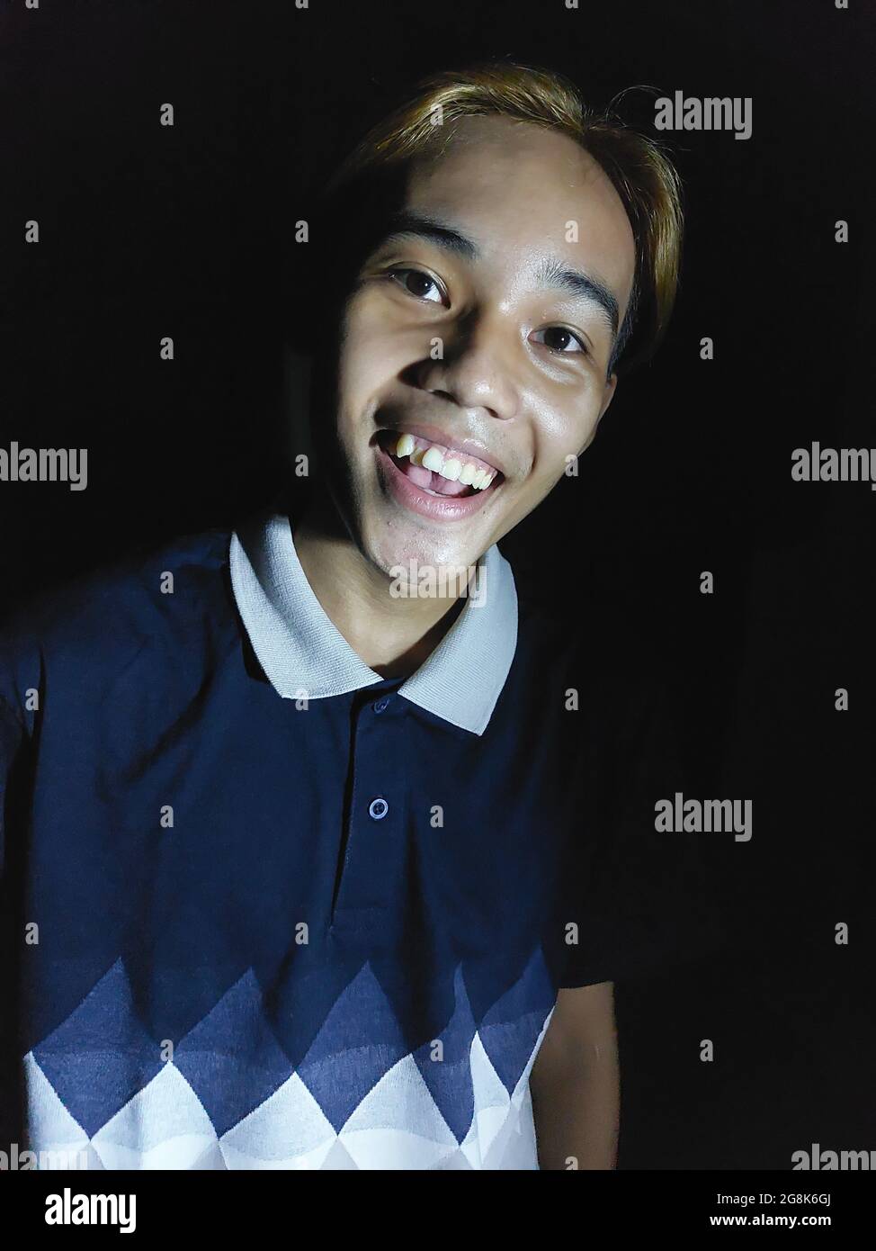 Laughing filipino male hi-res stock photography and images - Alamy