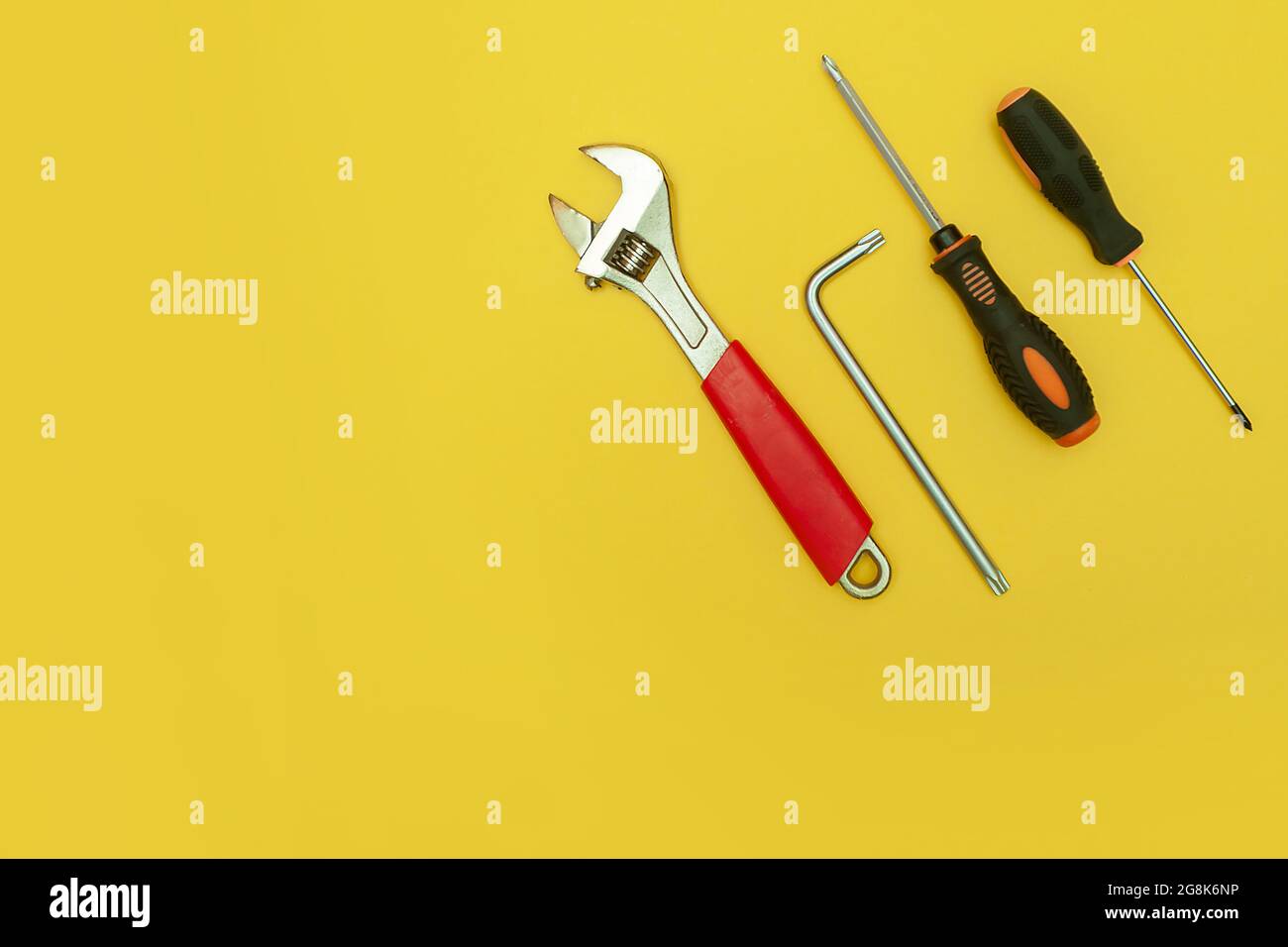 tools on isolated yellow background Stock Photo - Alamy