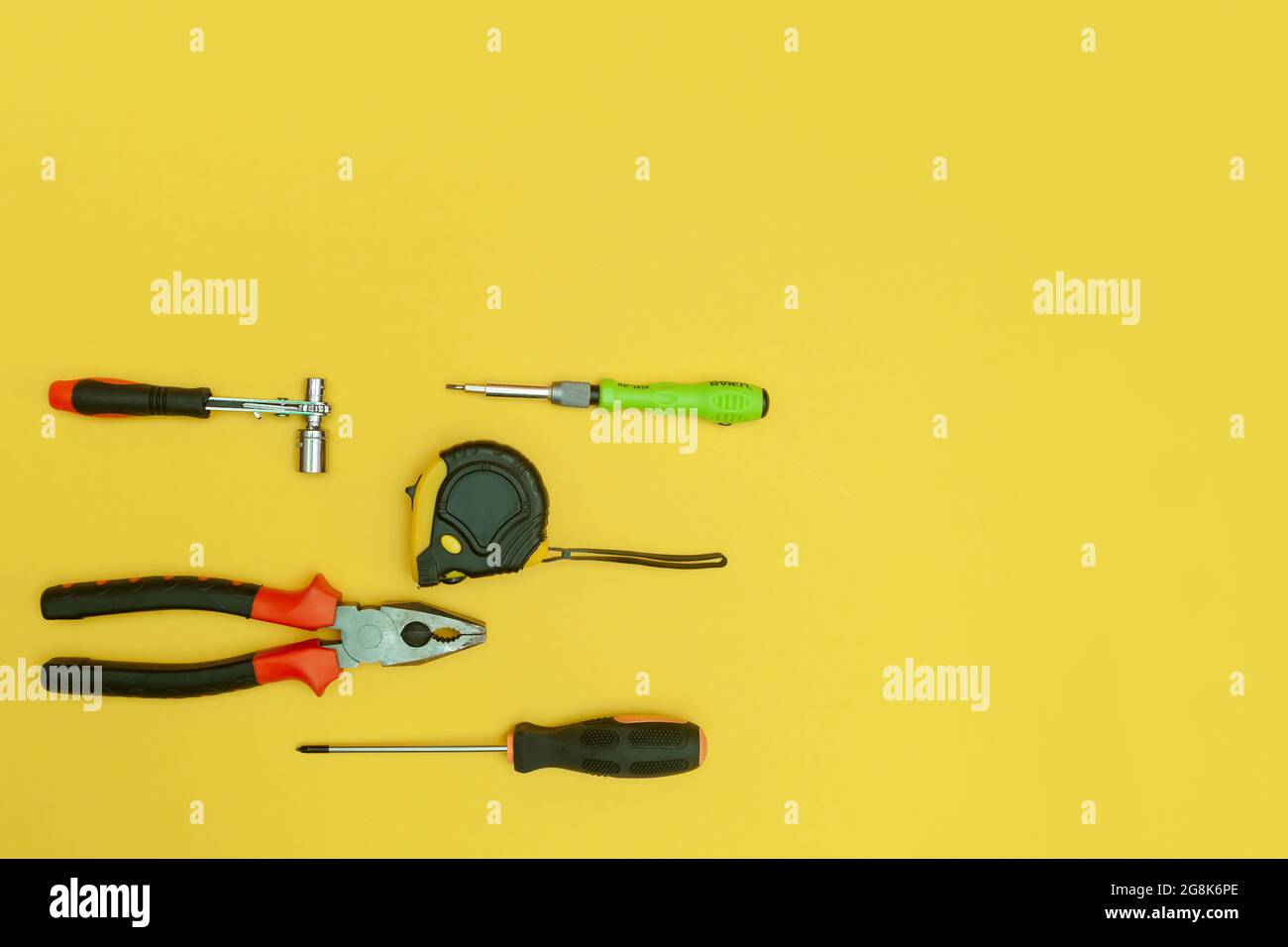 tools on isolated yellow background Stock Photo - Alamy