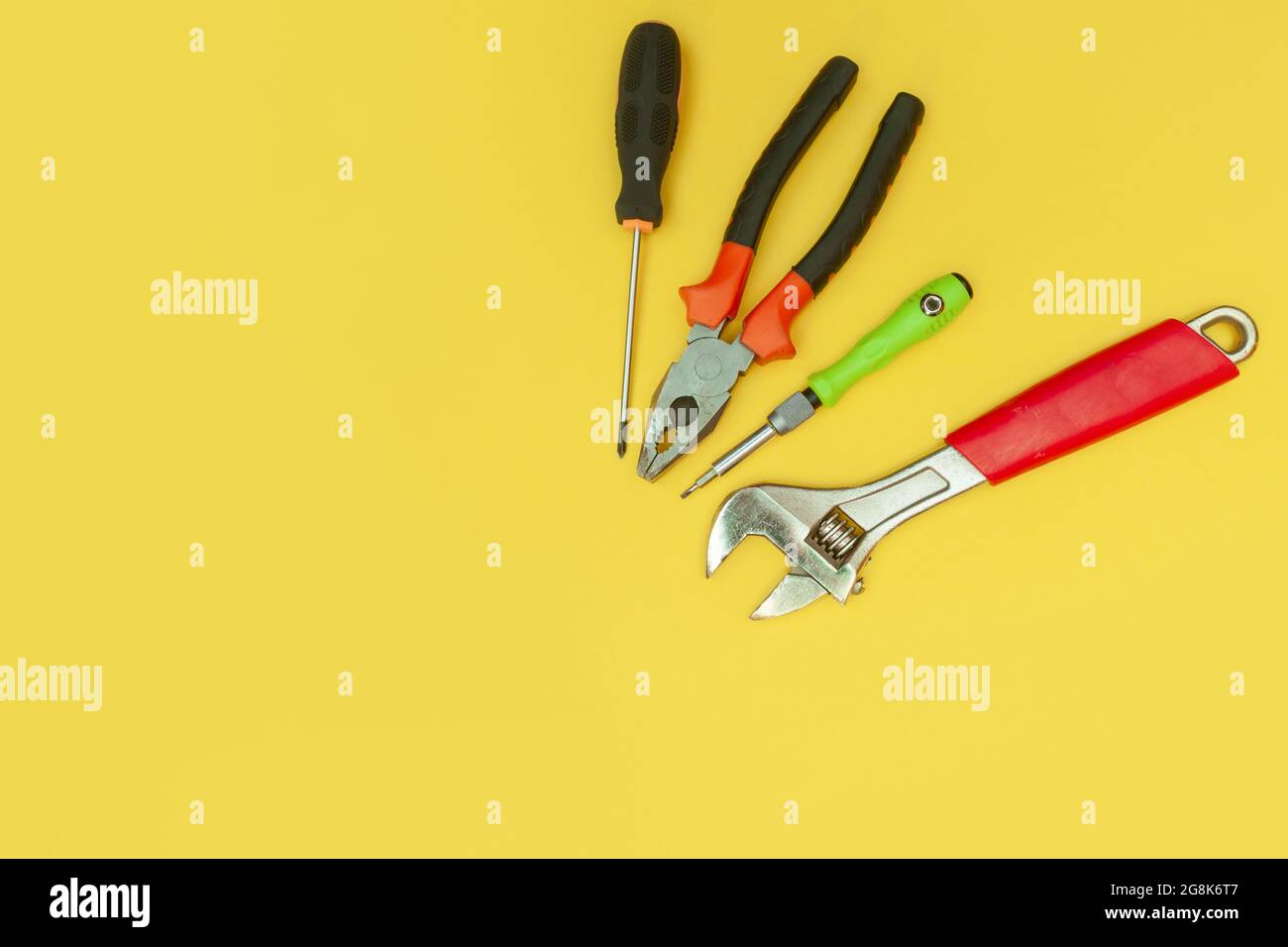 tools on isolated yellow background Stock Photo - Alamy