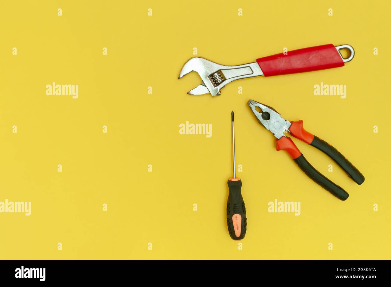 tools on isolated yellow background Stock Photo - Alamy