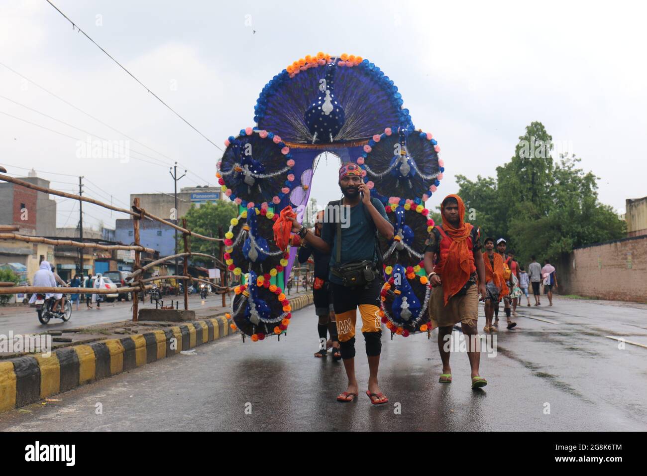 GHAZIABAD, INDIA - JULY 2019: A hindu devotee carrying kanwar on their ...